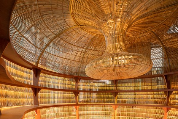 Rattan installation's natural forms in gallery composition