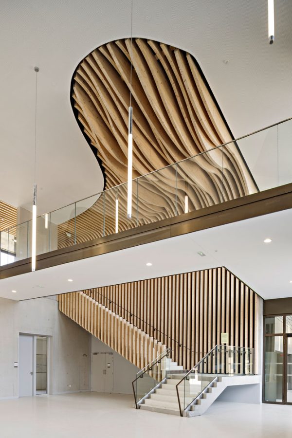 Facade of Lycée La Plaine imagined as a tangle of moving ribbons